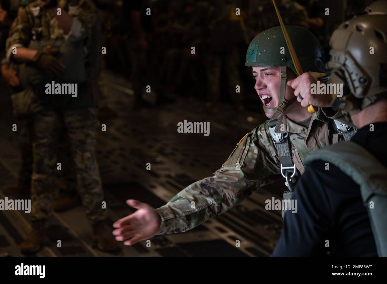 A member of Jumpmaster School Class 007-22 simulates sending the first ...