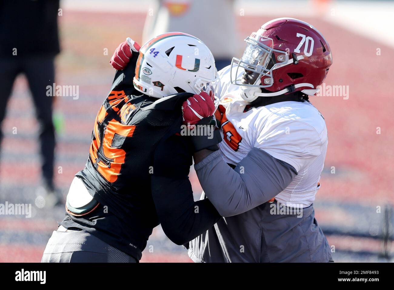 Quincy Roche of Miami, Florida (55) and offensive lineman Alex ...
