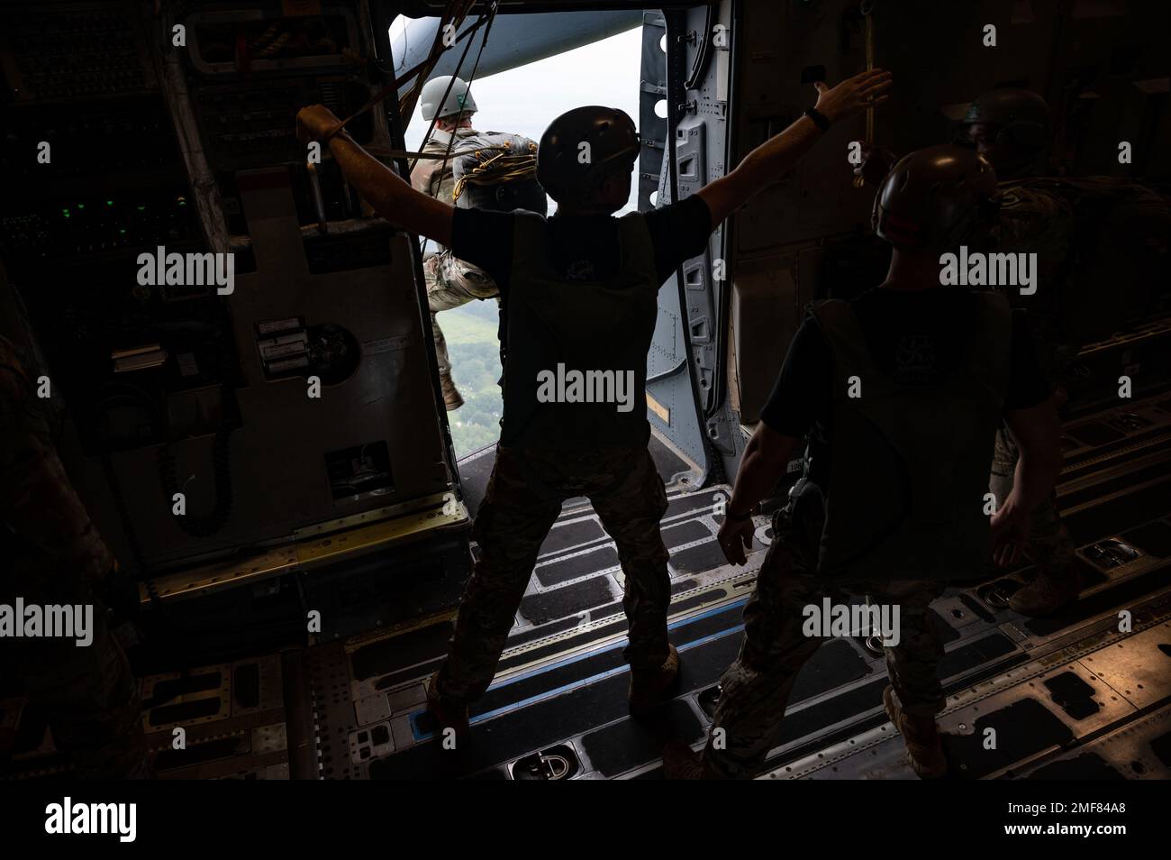 Members of Jumpmaster School Class 007-22 static line jump out a U.S ...
