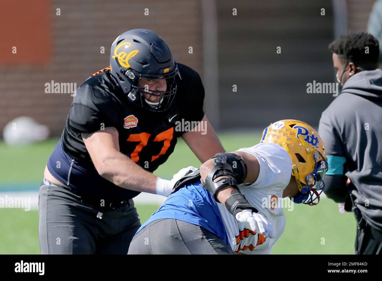 Offensive lineman Jake Curhan of California (77) blocks defensive ...