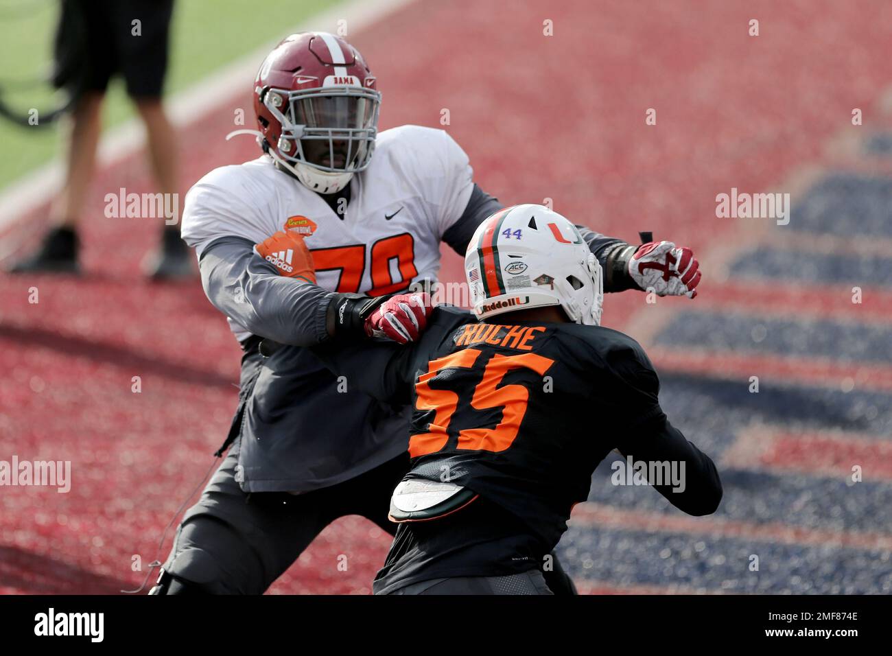Offensive lineman Alex Leatherwood of Alabama (70) and Quincy Roche of ...