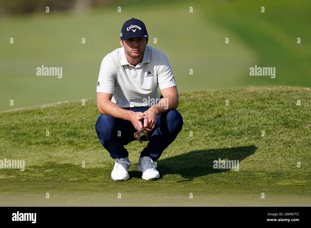 Sam Burns lines up a putt on the ninth hole of the North Course during ...