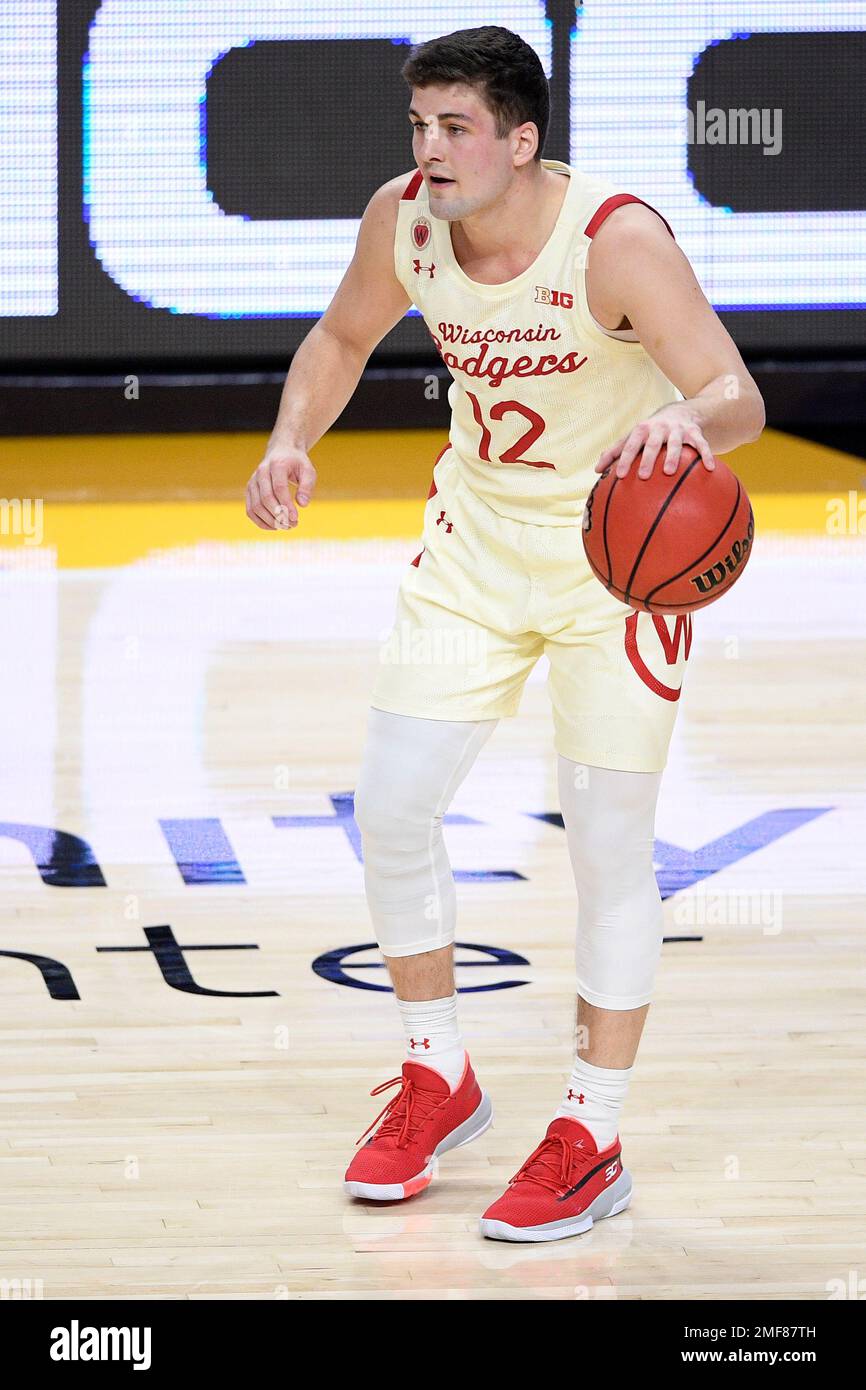 Wisconsin guard Trevor Anderson (12) dribbles the ball during the first ...