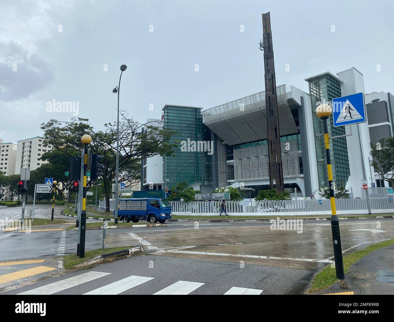 A van passes in front of the Assyafaah Mosque in Singapore, Thursday ...