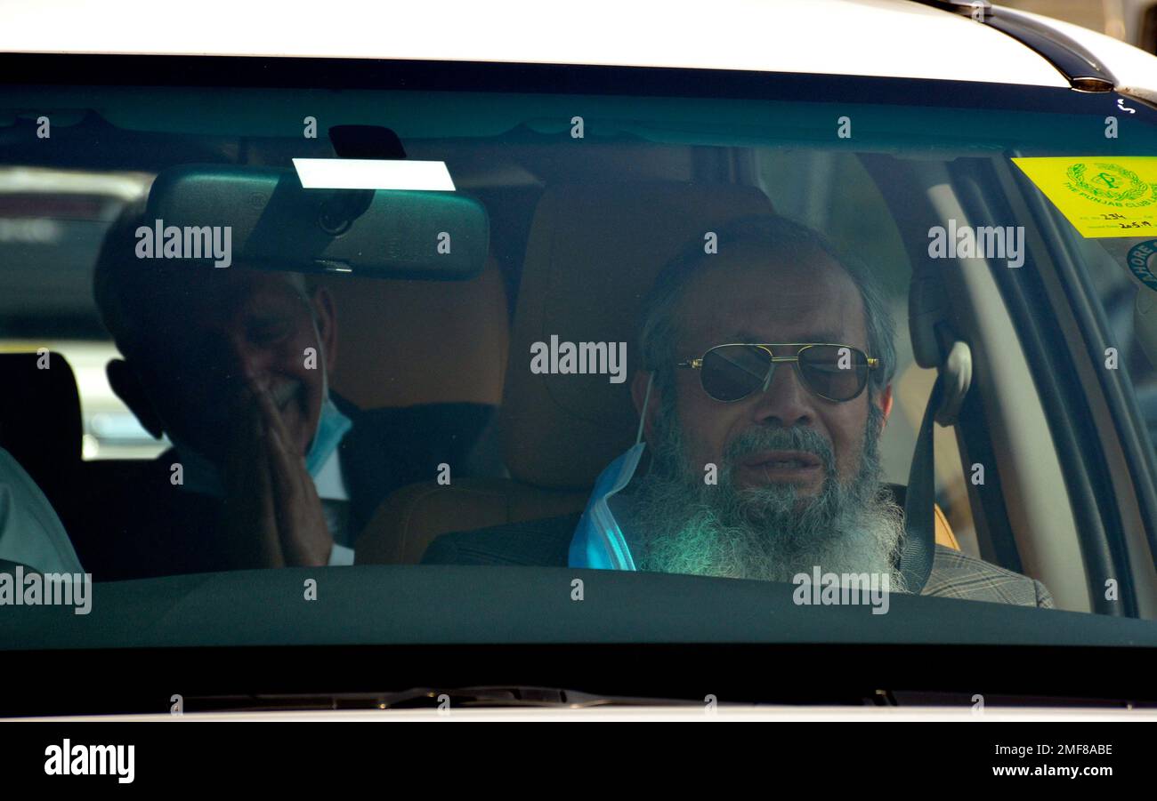 Ahmed Saeed Sheikh, right, father of British-born Pakistani Ahmed Omar Saeed Sheikh, leaves the ...