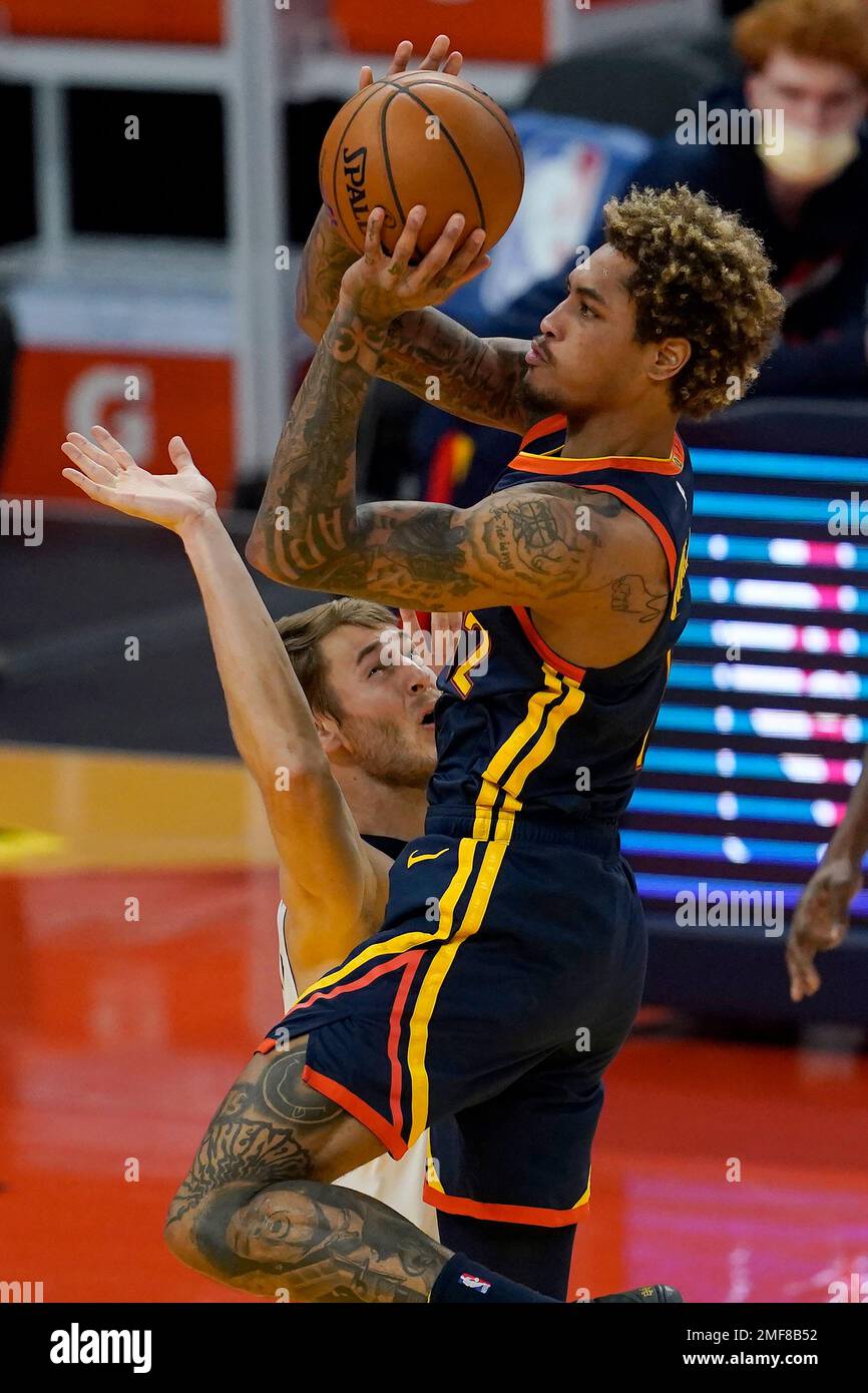 Golden State Warriors guard Kelly Oubre Jr., top, shoots over Minnesota ...