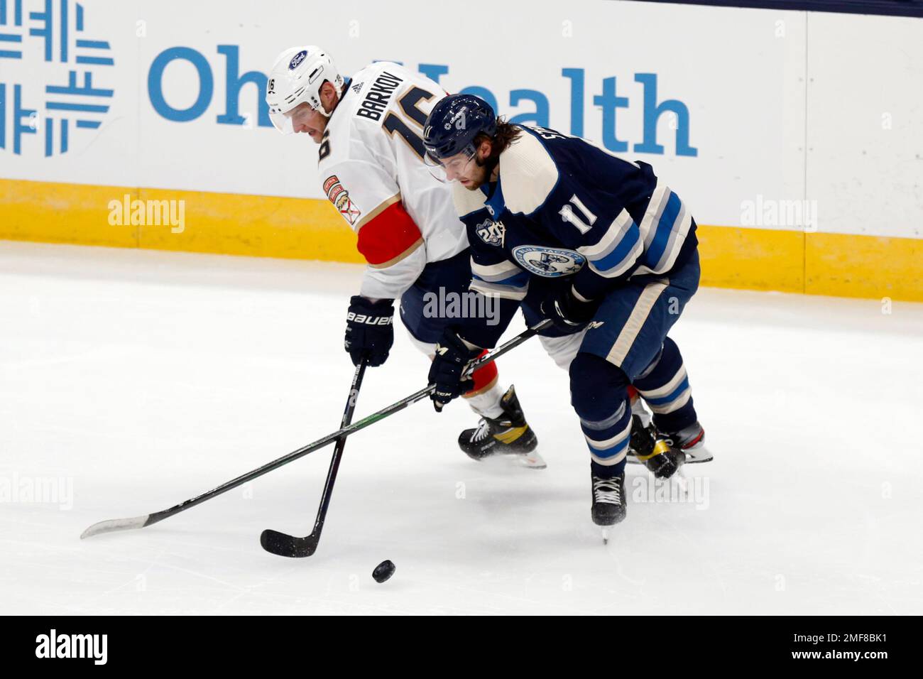 Columbus Blue Jackets forward Kevin Stenlund, right, of Sweden, against ...