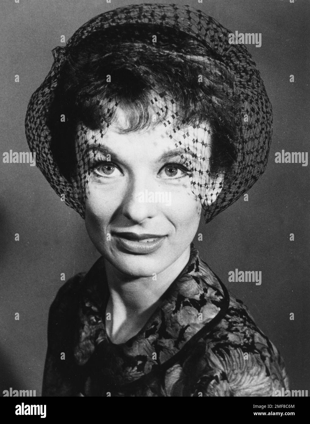 FILE - Actress Cloris Leachman wears a headband hat with black tulip ...
