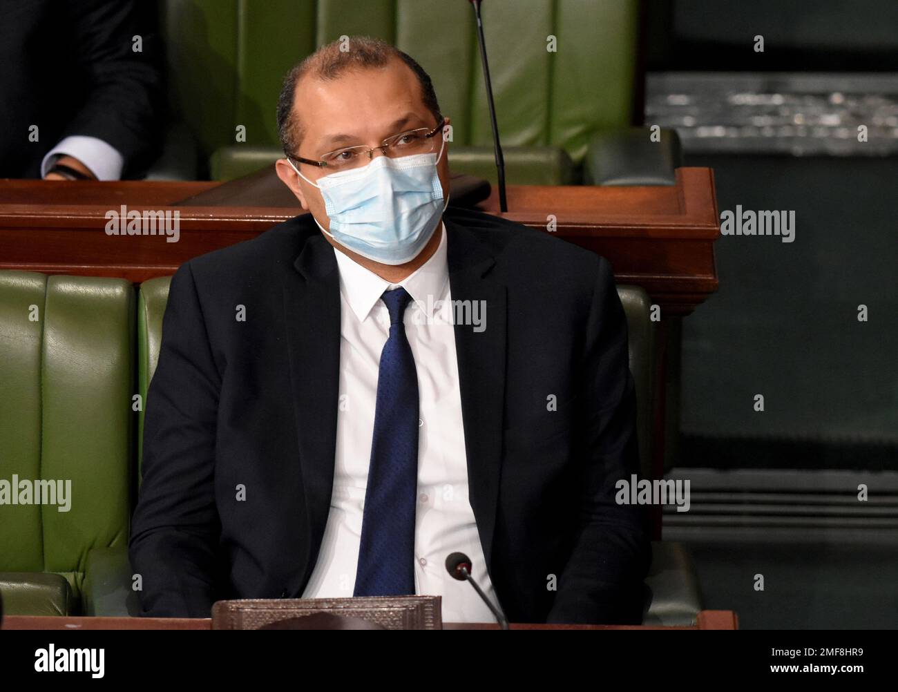 Tunisian Prime Minister Hichem Mechichi listens to debates as the ...