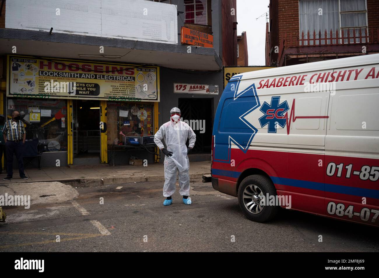 Paramedic Clive Maleso stands next to a Saaberie Chishty ambulance ...