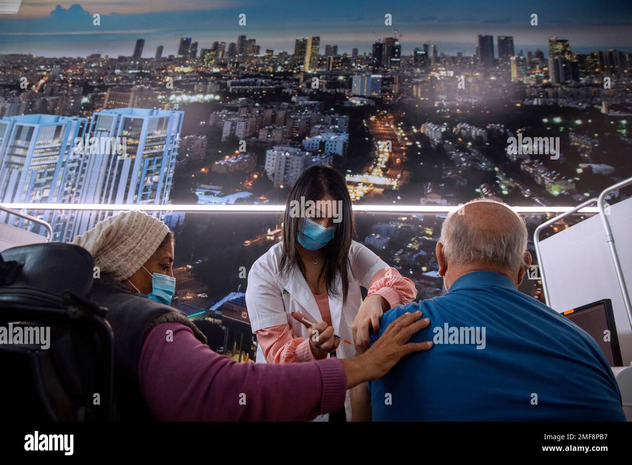 An Israeli man receives the second dose of the Pfizer-BioNTech COVID-19 ...