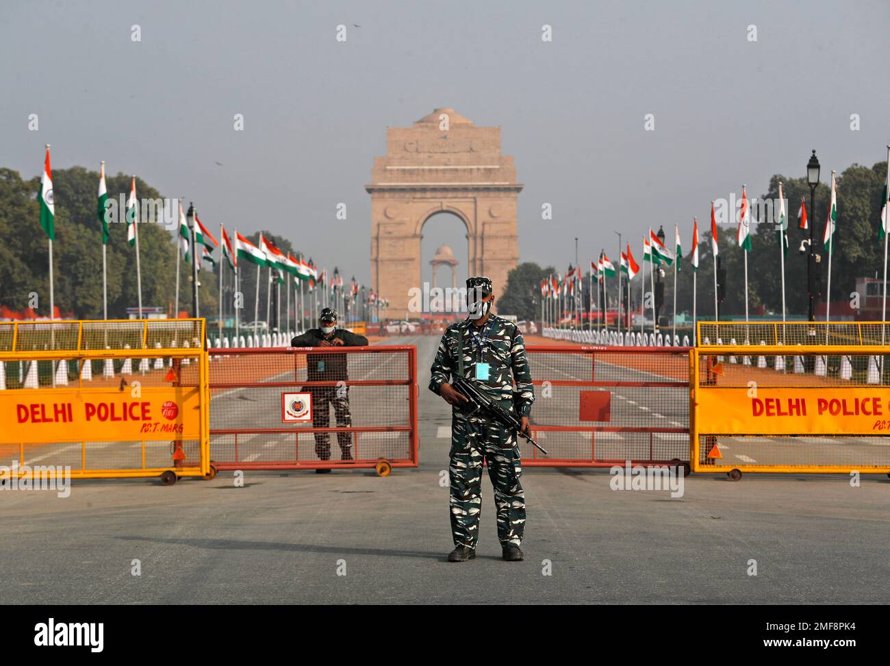 Indian para-military force soldiers stand guard at Rajpath, a ...