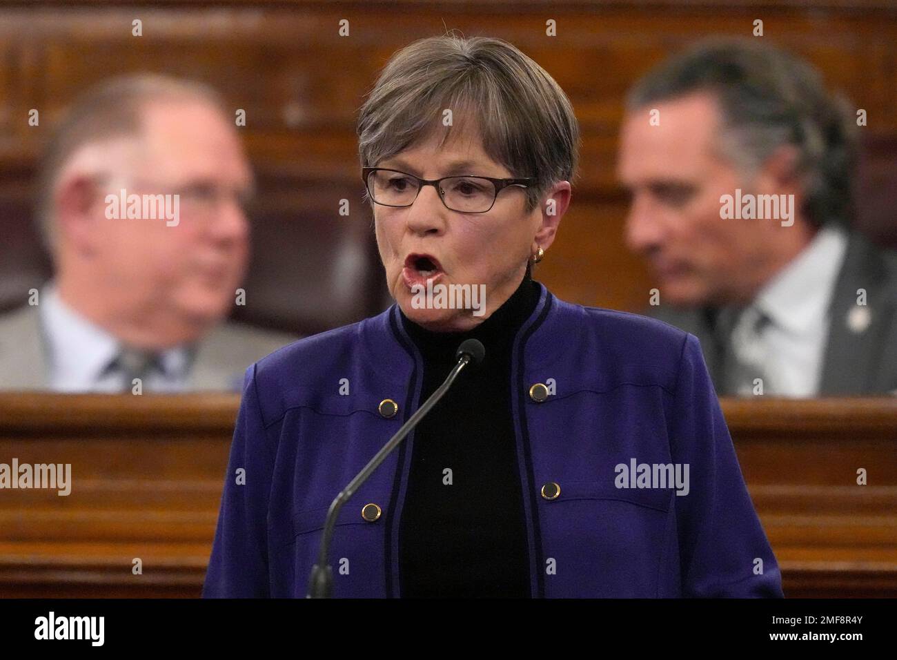 Flanked by Speaker of the House Daniel Hawkins, left, and Senate ...
