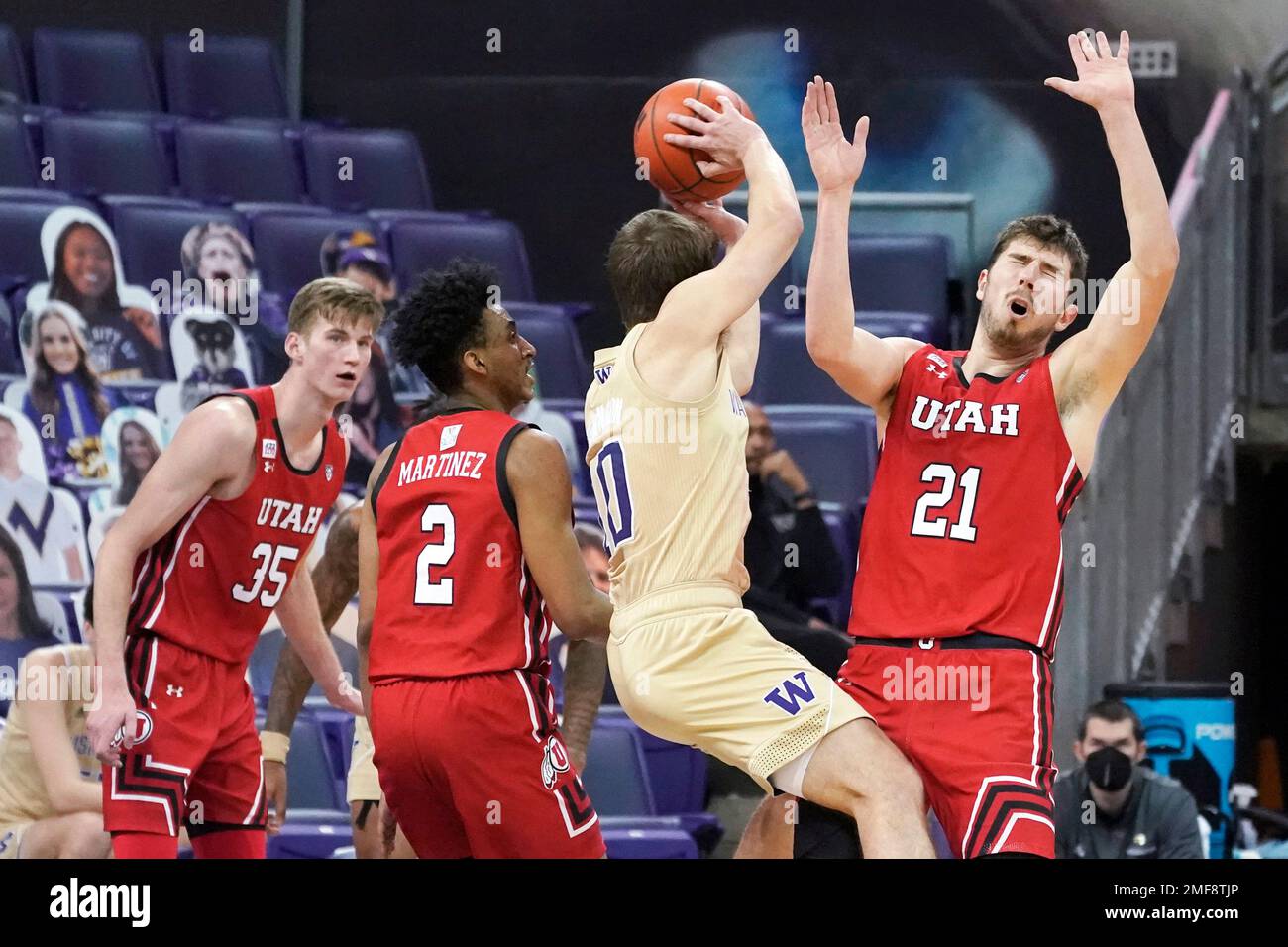 Utah forward Riley Battin (21) reacts as Washington guard Erik ...