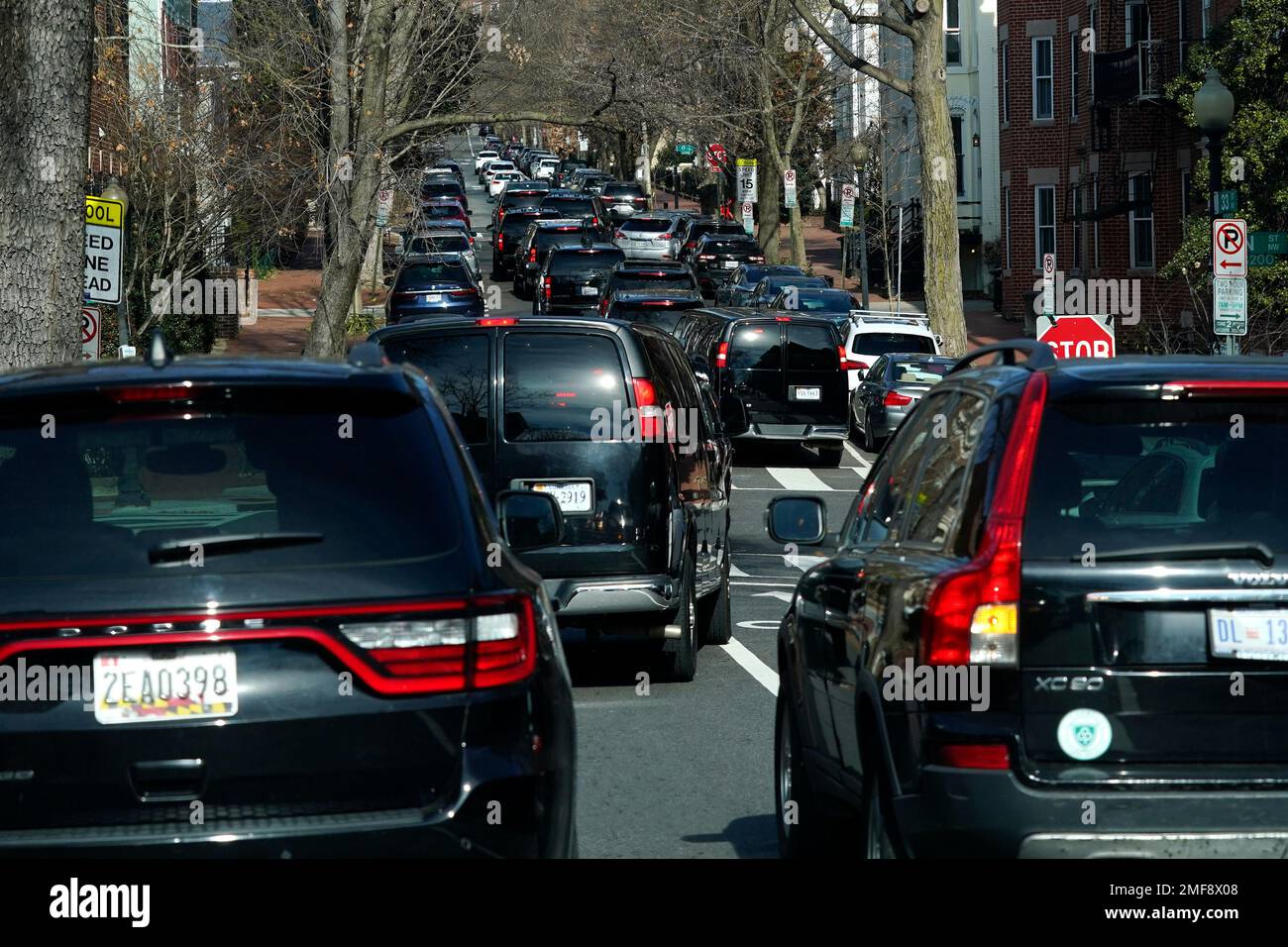 President Joe Biden's motorcade drives through the Georgetown ...