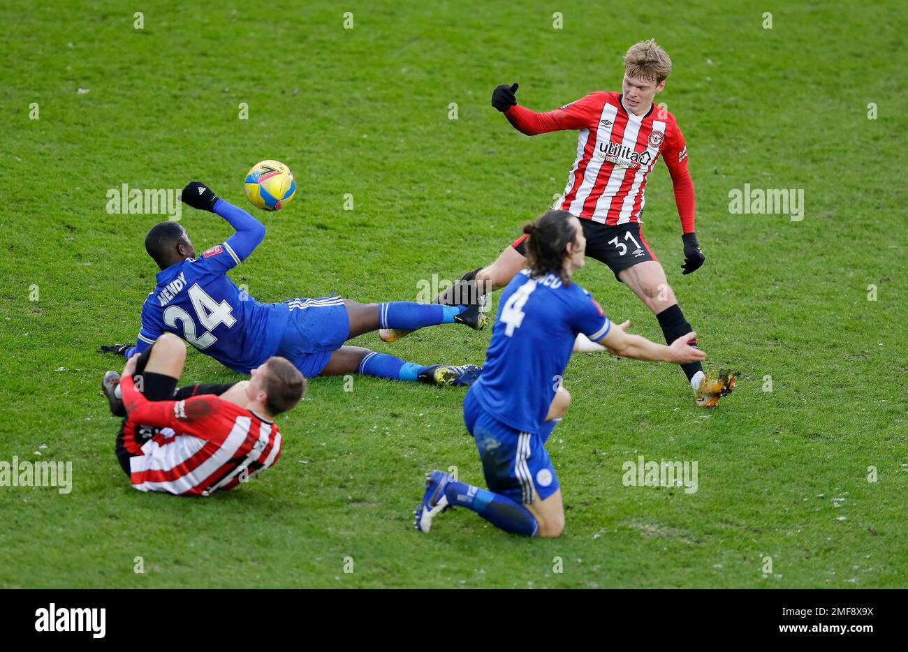 Leicester's Nampalys Mendy, top left, challenges for the ball with Brentford's Jan Zamburek, top ...