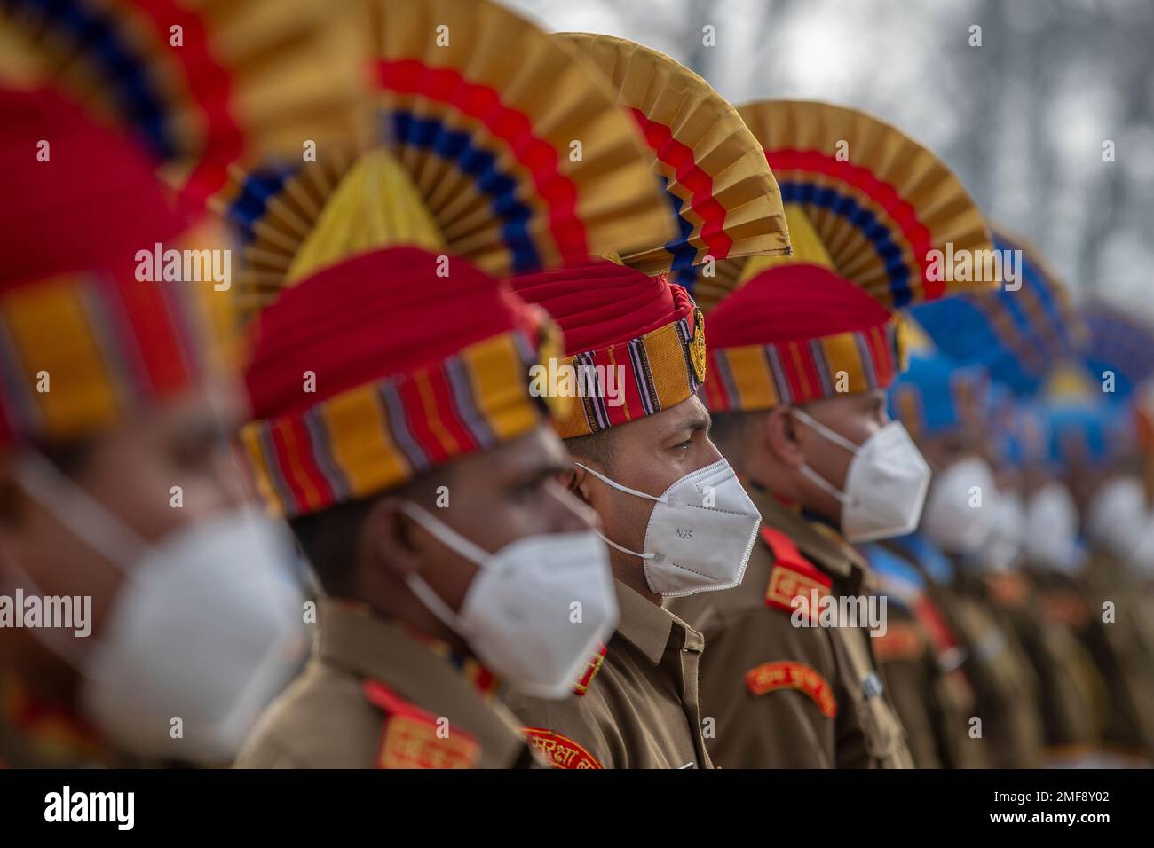 Indian paramilitary soldiers wearing masks take part in full dress ...