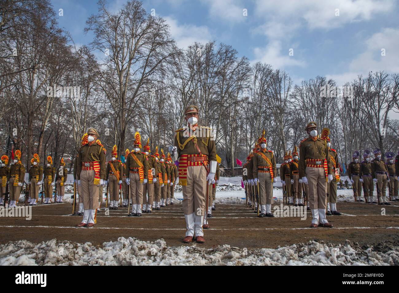 Indian paramilitary soldiers wearing masks take part in full dress ...