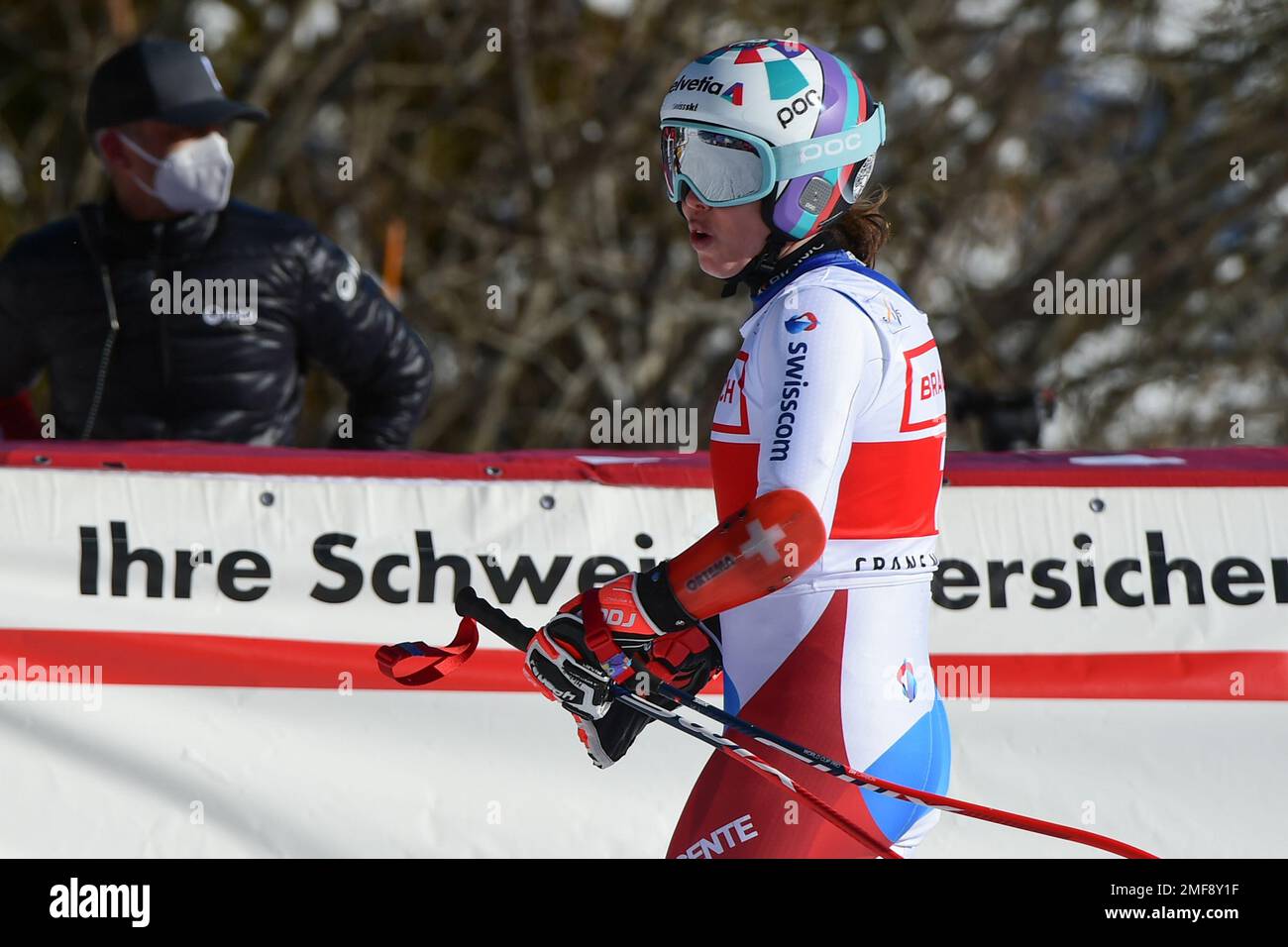 Switzerland's Michelle Gisin gets to the finish line after skiing off ...