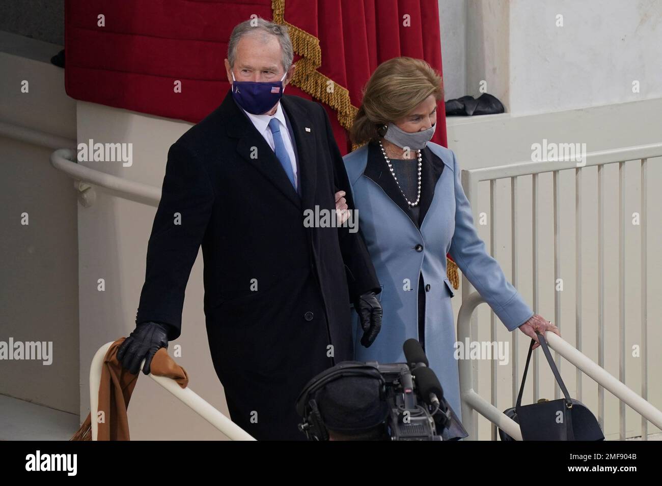 Former President George W. Bush and his wife Laura arrive for the 59th ...