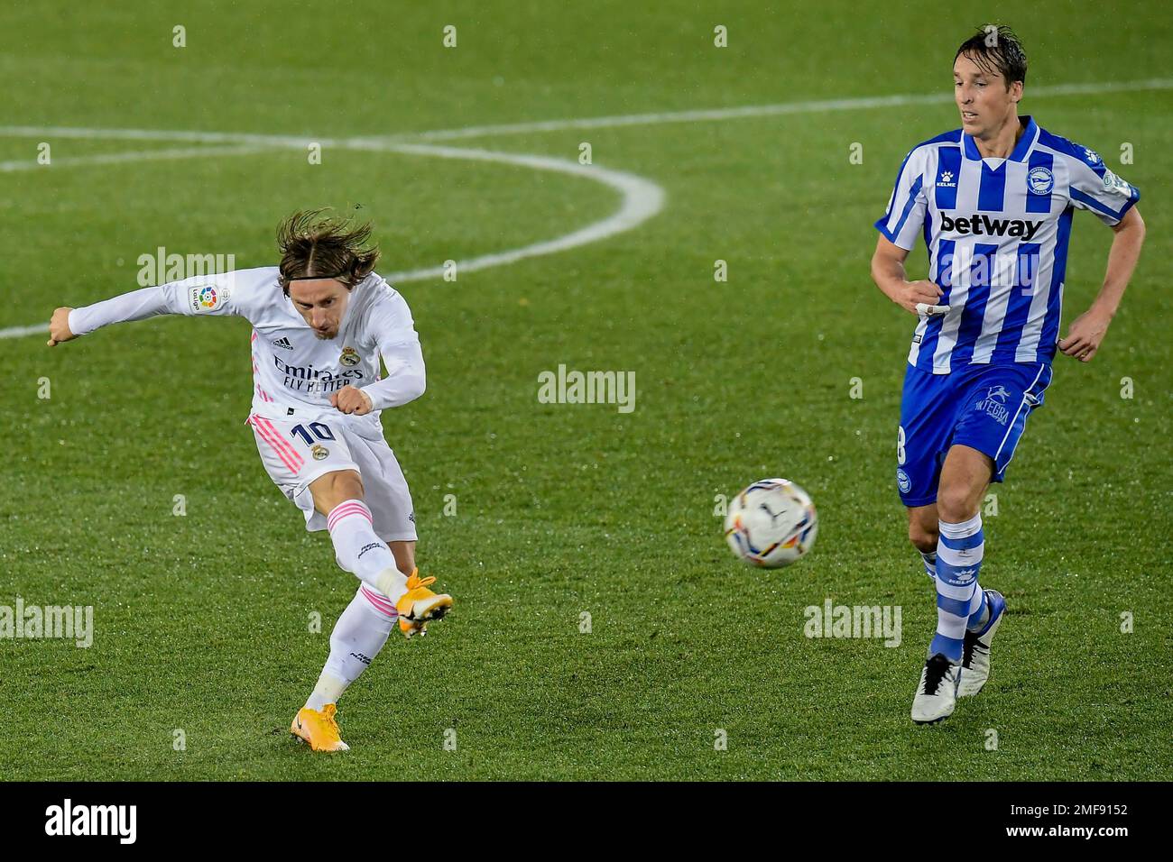 Real Madrid's Luka Modric, left, tries a shot during the Spanish La ...