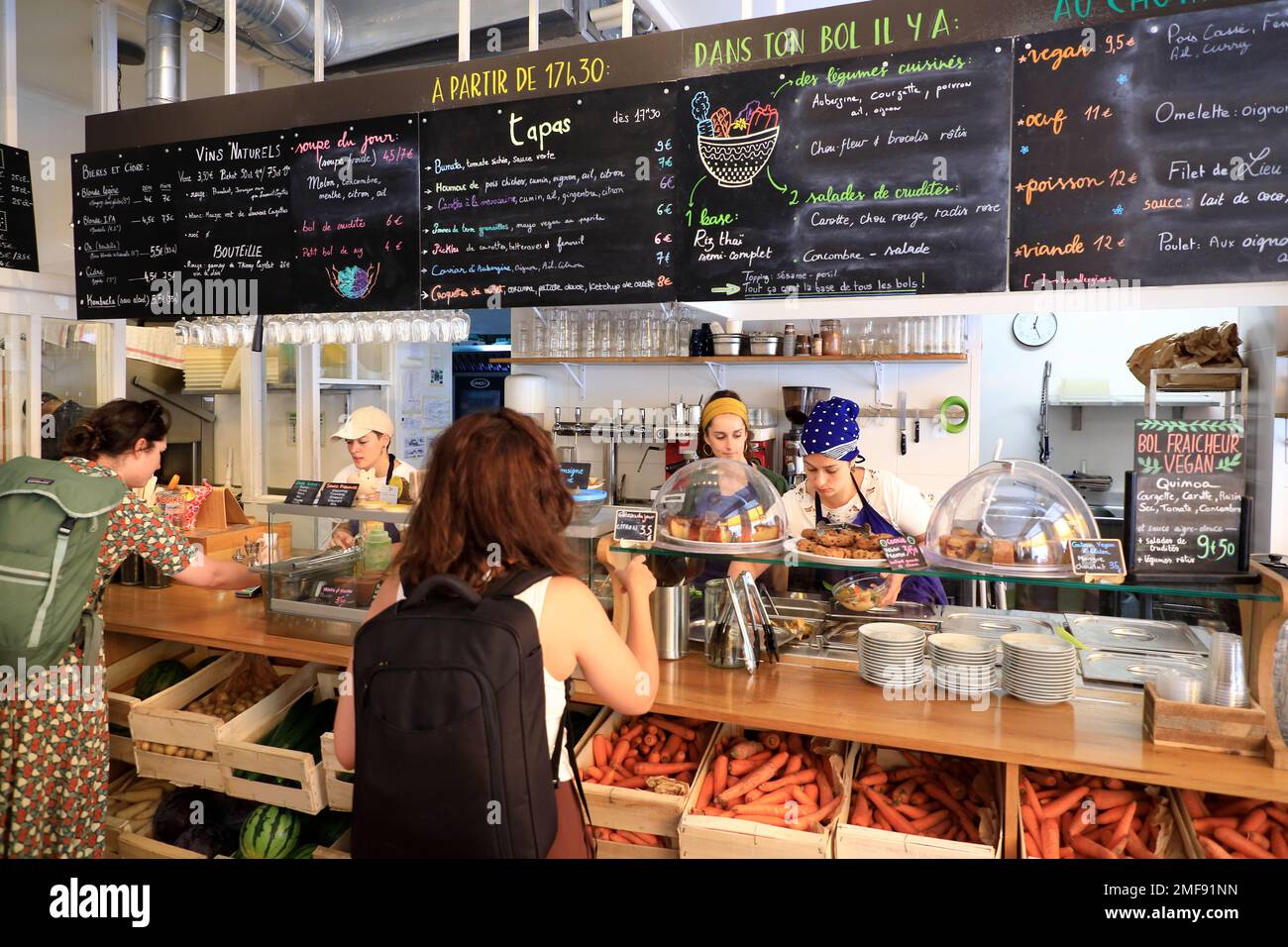 Customers ordering meal in Le Bichat, a eco-friendly and vegetarian ...