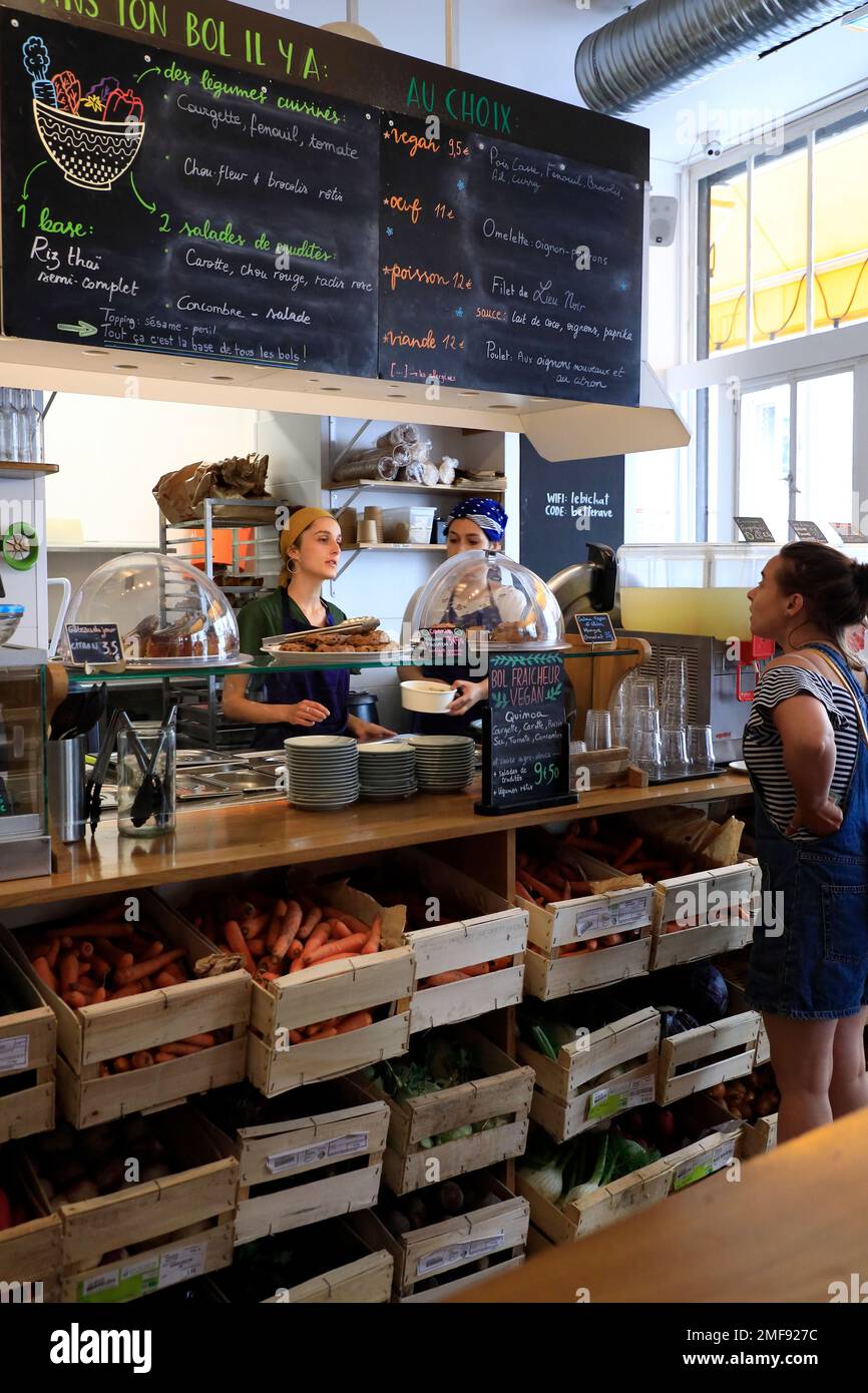 Customers ordering meal in Le Bichat, a eco-friendly and vegetarian ...