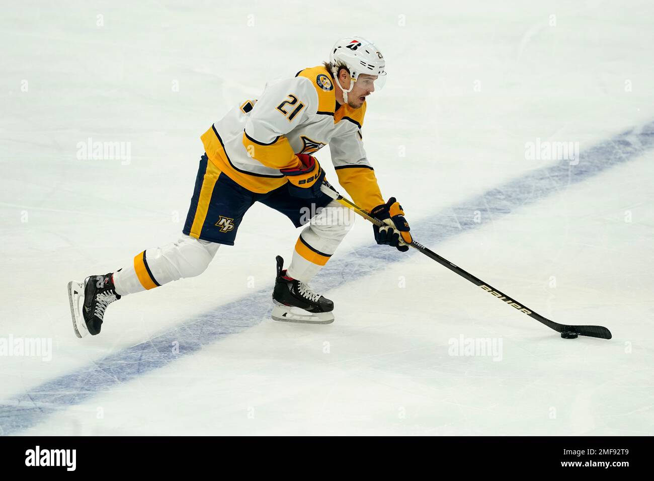 Nashville Predators center Nick Cousins (21) handles the puck during an ...