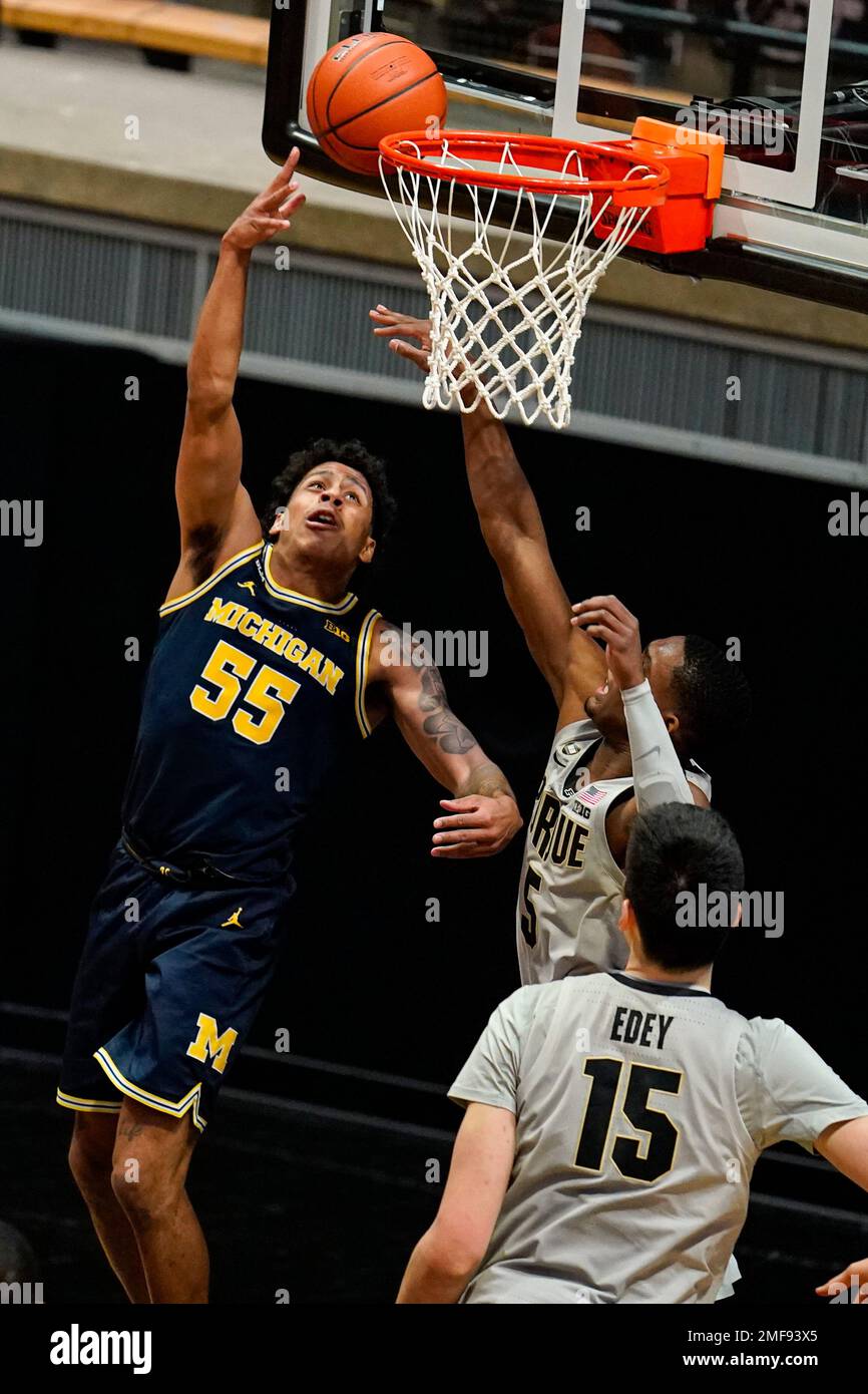 Michigan guard Eli Brooks (55) shoots in front of Purdue guard Brandon ... Michigan guard Eli Brooks (55) shoots in front of Purdue guard Brandon ...