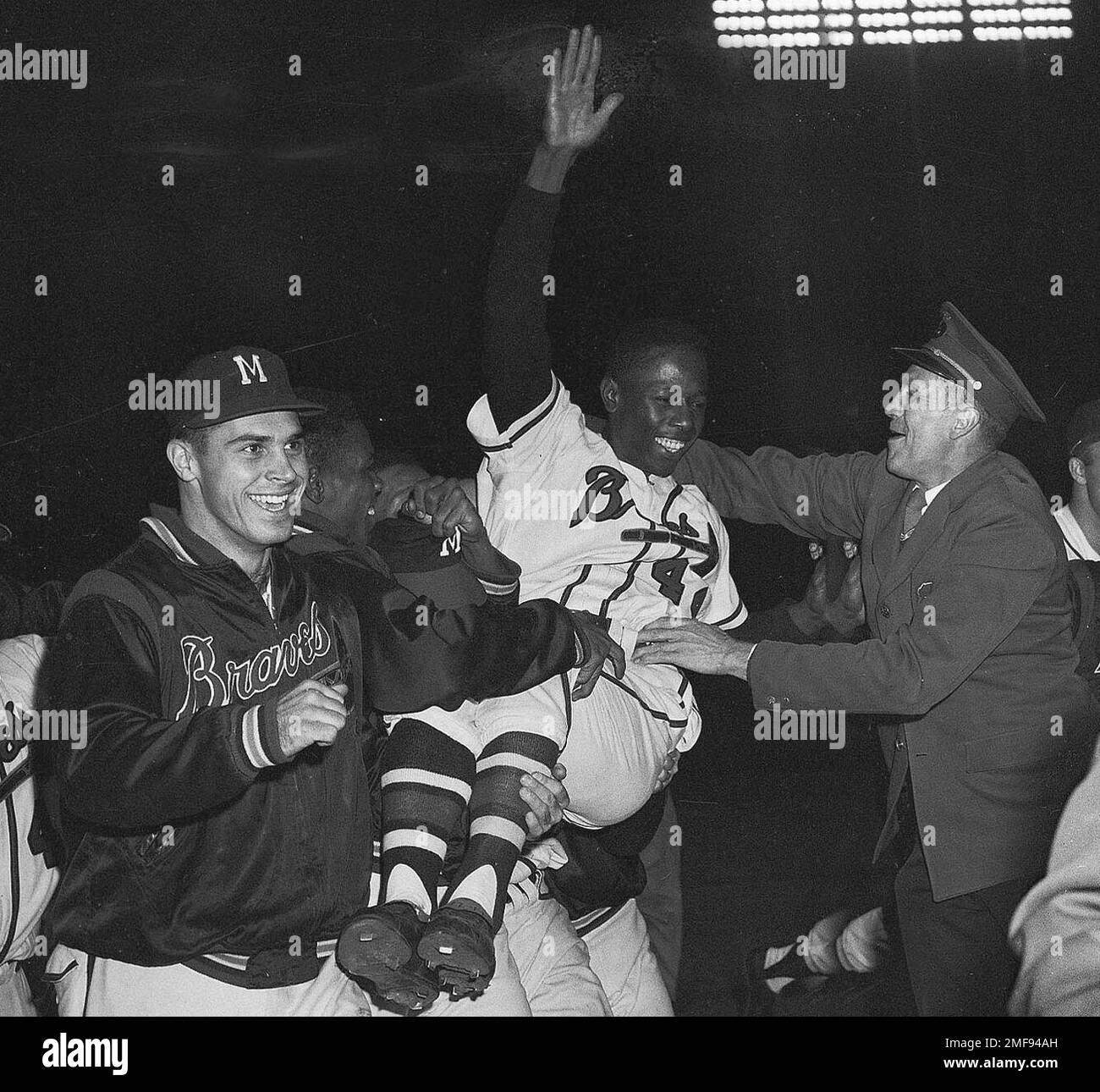 Milwaukee Braves' Hank Aaron is carried from the baseball field Sept ...
