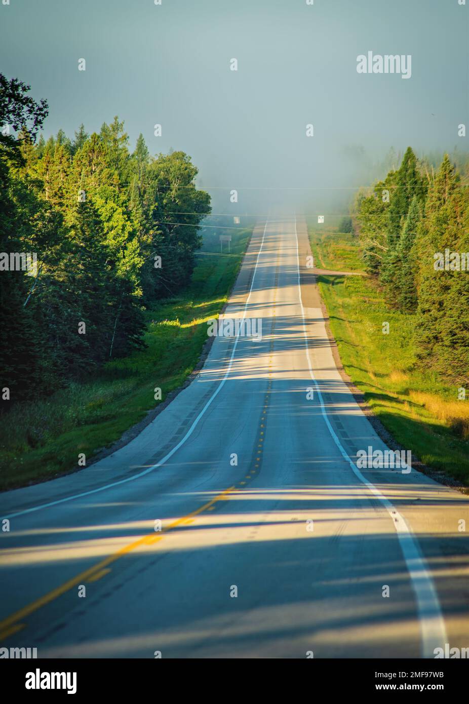 Fog drifting over roadway in Michigan Upper Peninsula Stock Photo - Alamy