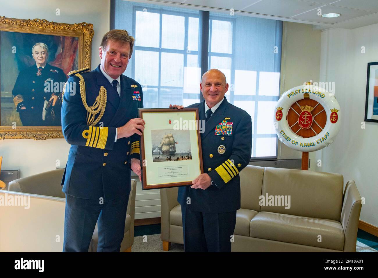 LONDON (Aug. 18, 2022) - Chief of Naval Operations Adm. Mike Gilday receives a gift from Royal ...