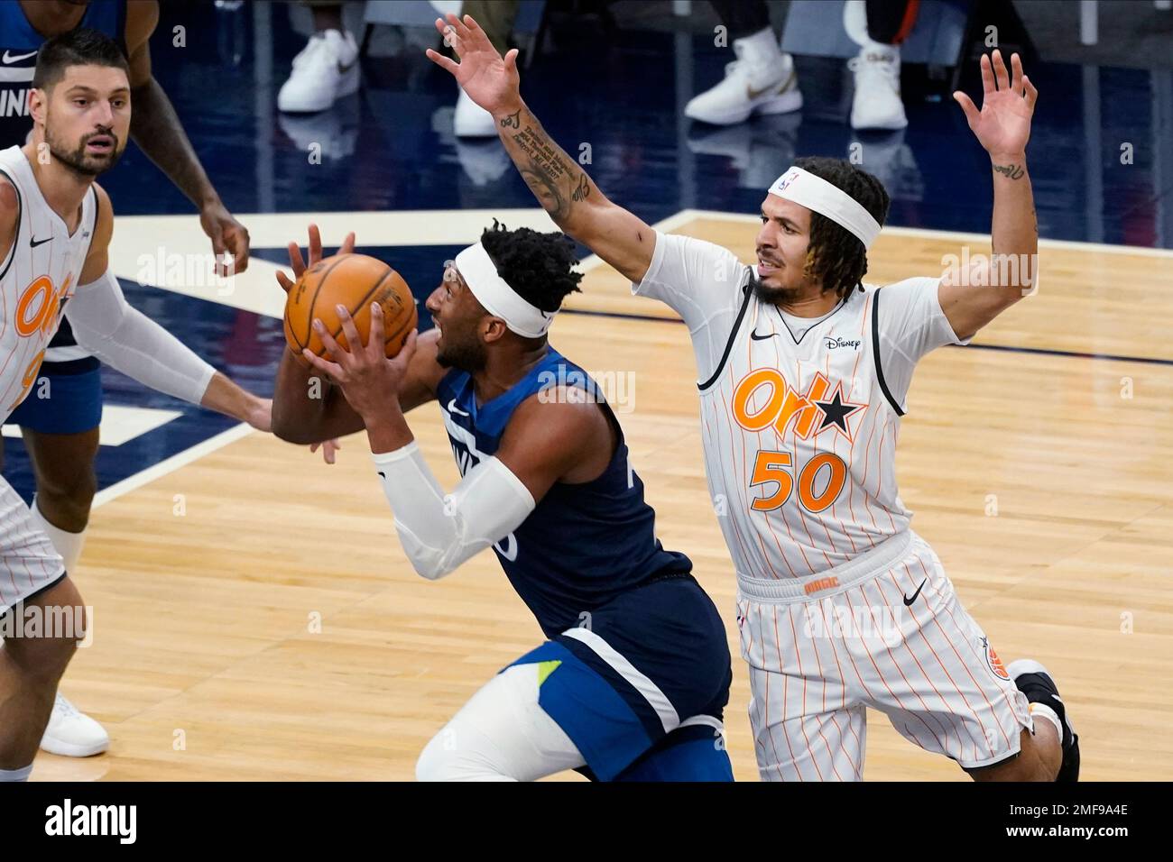 CORRECTS ORLANDO PLAYER AT LEFT TO NIKOLA VUCEVIC, INSTEAD OF AARON ...