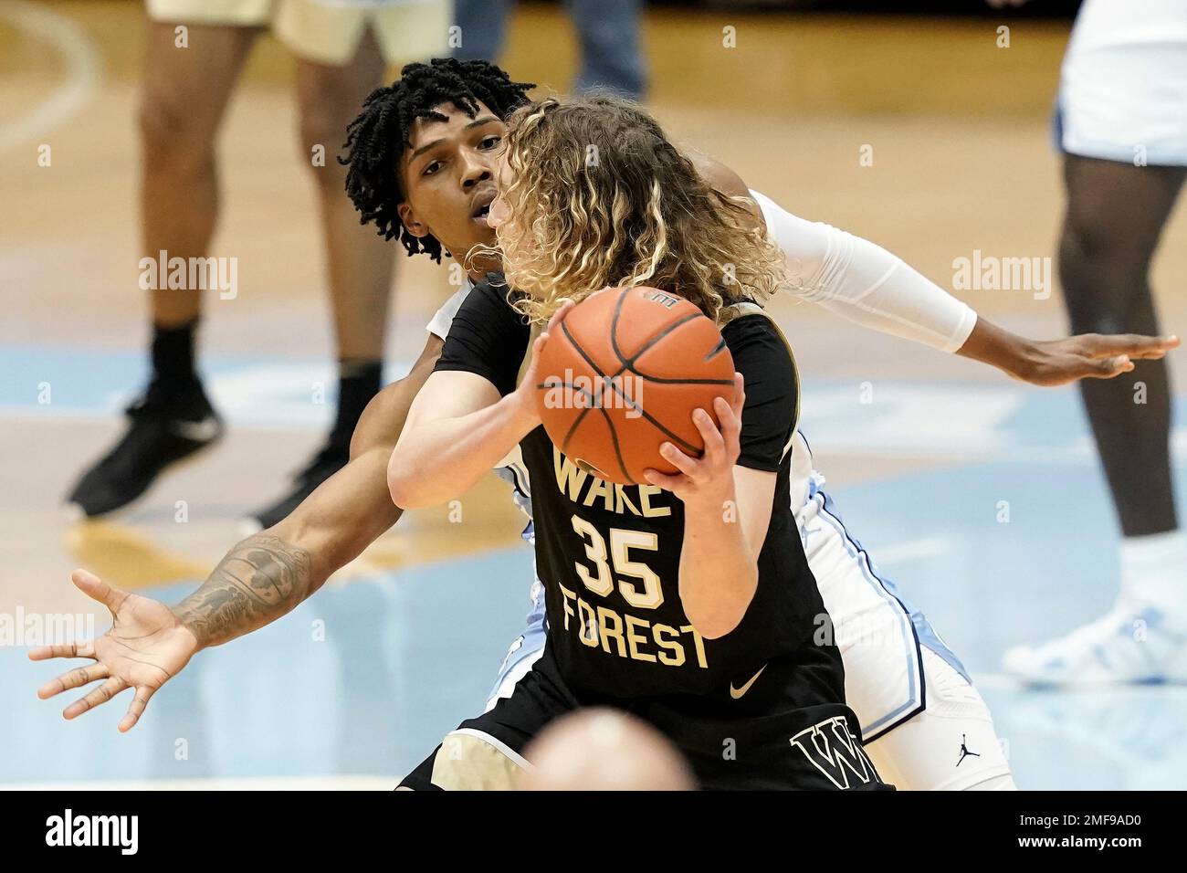 North Carolina guard Caleb Love pressures Wake Forest guard Carter ...