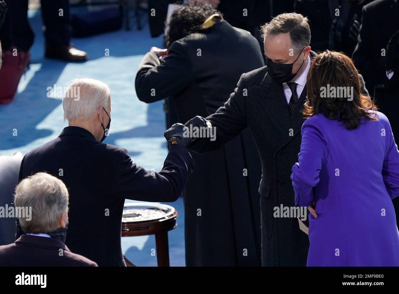 President-elect Joe Biden bumps fists with Doug Emoff during the 59th ...