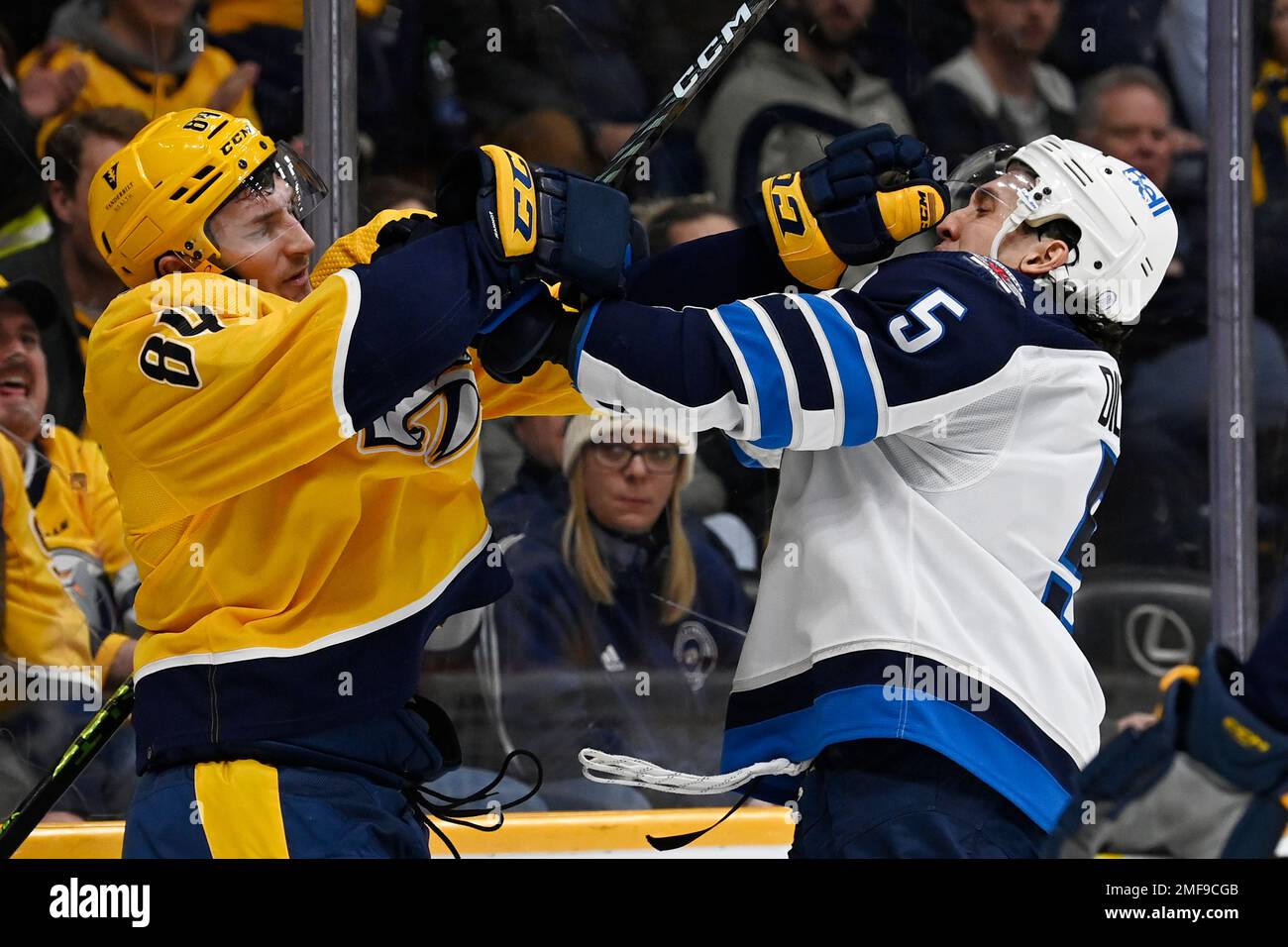 Winnipeg Jets defenseman Brenden Dillon (5) scuffles with Nashville ...
