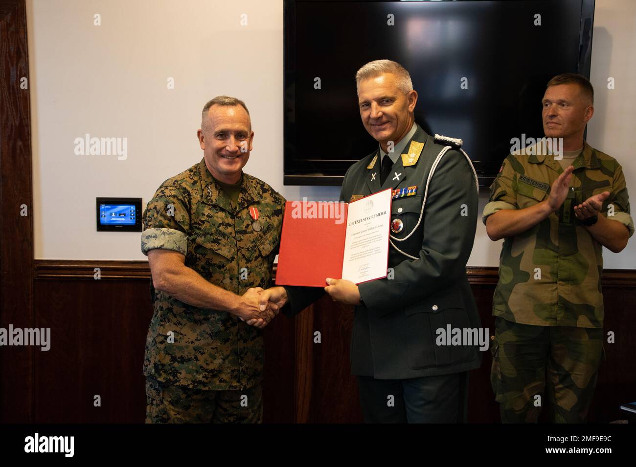 Norwegian Defense Attaché Major General Odd-Harald Hagen presented an award to U.S. Marine Corps ...