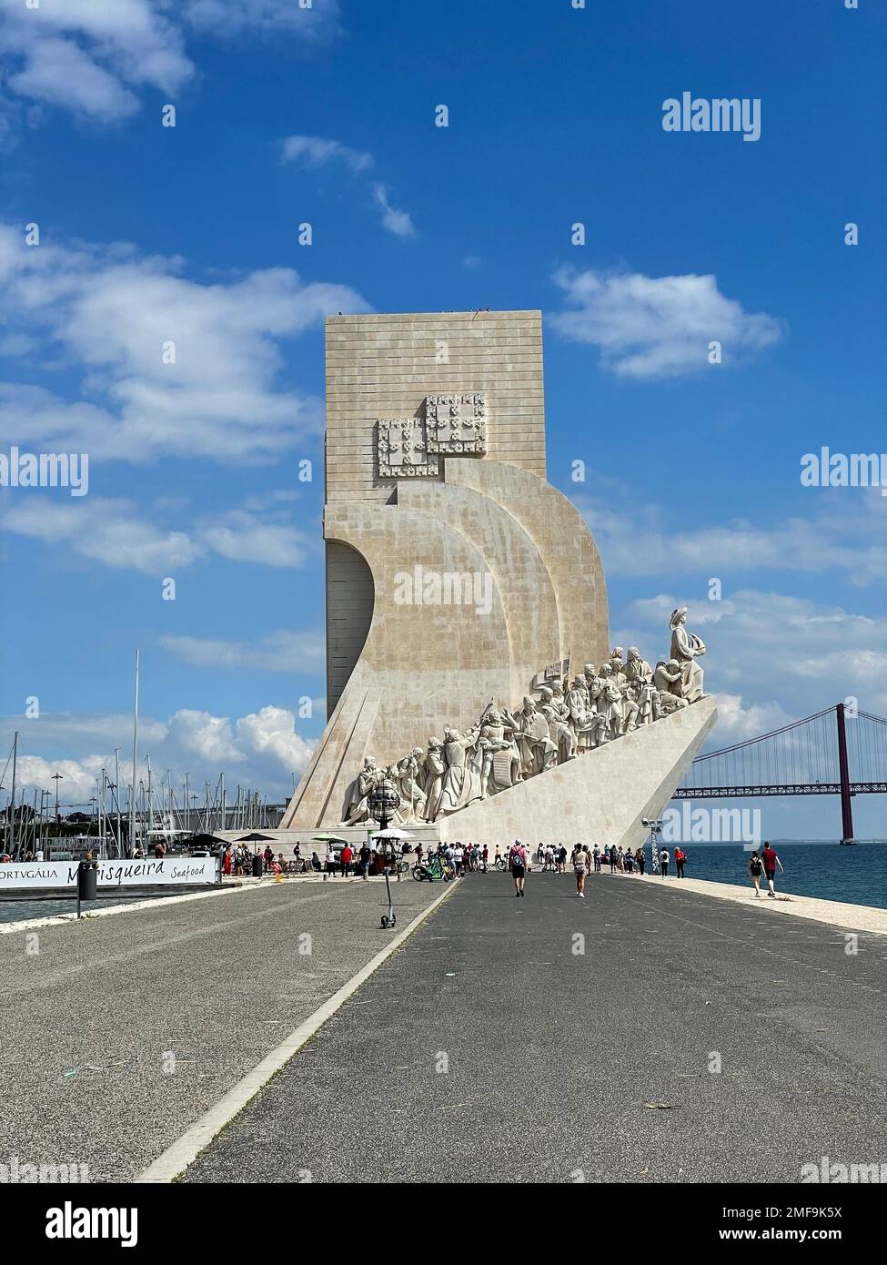 The Monument of the Discoveries on the edge of the Tagus River with ...