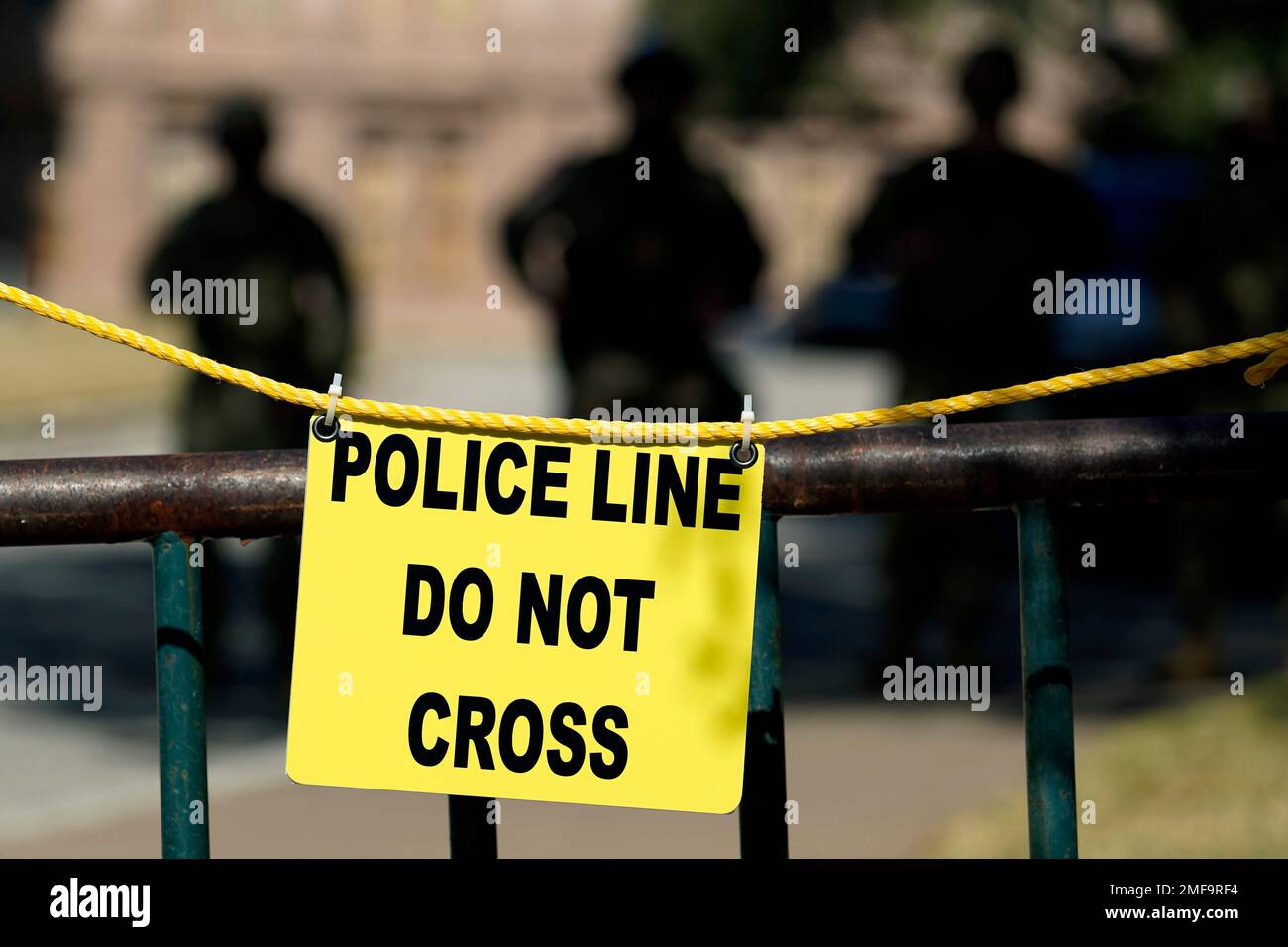 Texas state troopers guard the ground of the Texas State Capitol ...