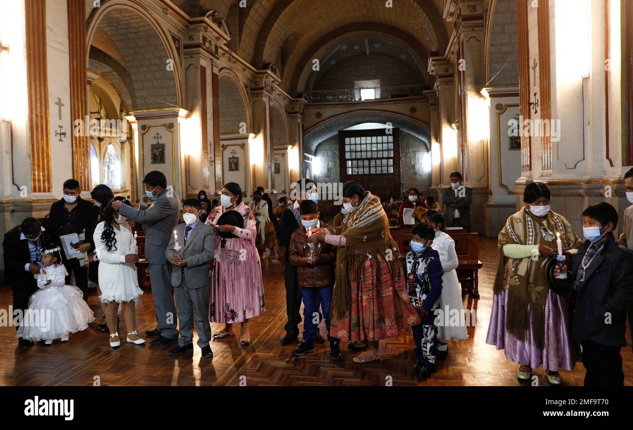 Godparents and their godchildren wearing masks to prevent the spread of ...