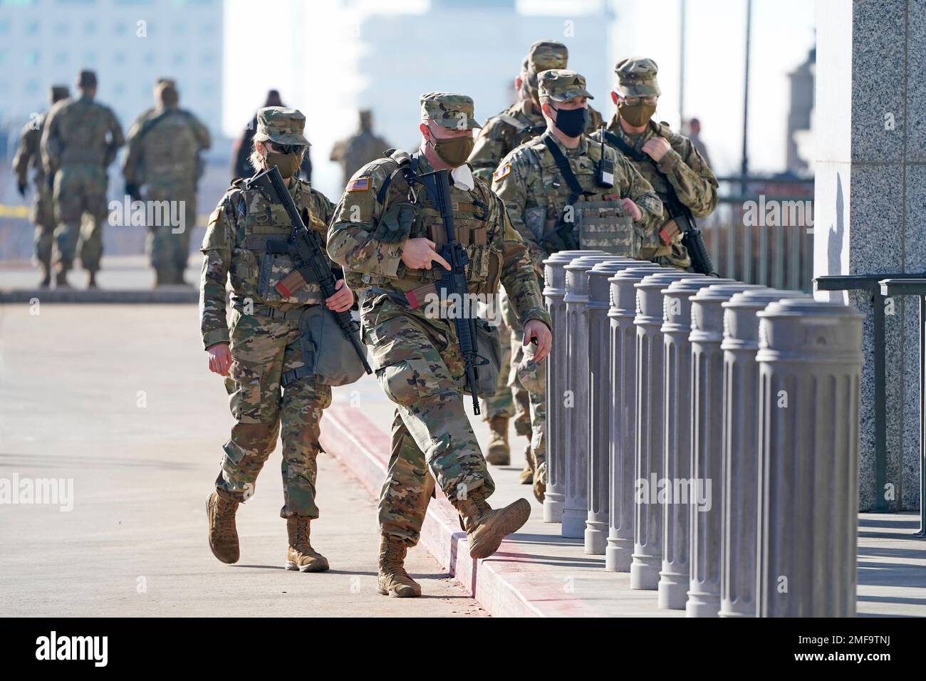 Utah National Guardsmen walk near the Utah State Capitol Sunday, Jan ...