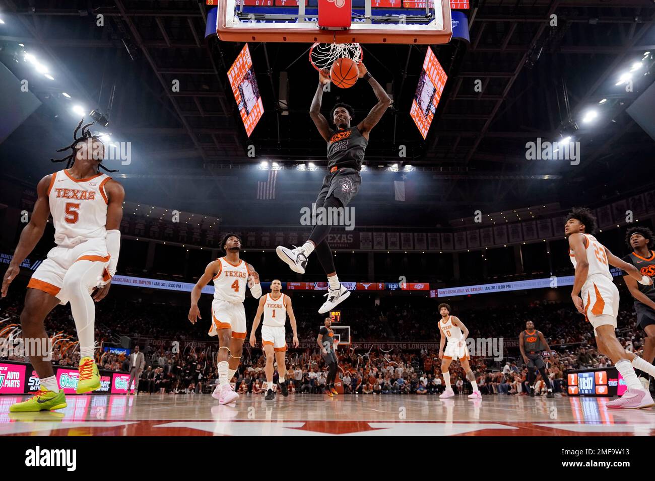 Oklahoma State forward Kalib Boone (22) scores against Texas during the ...