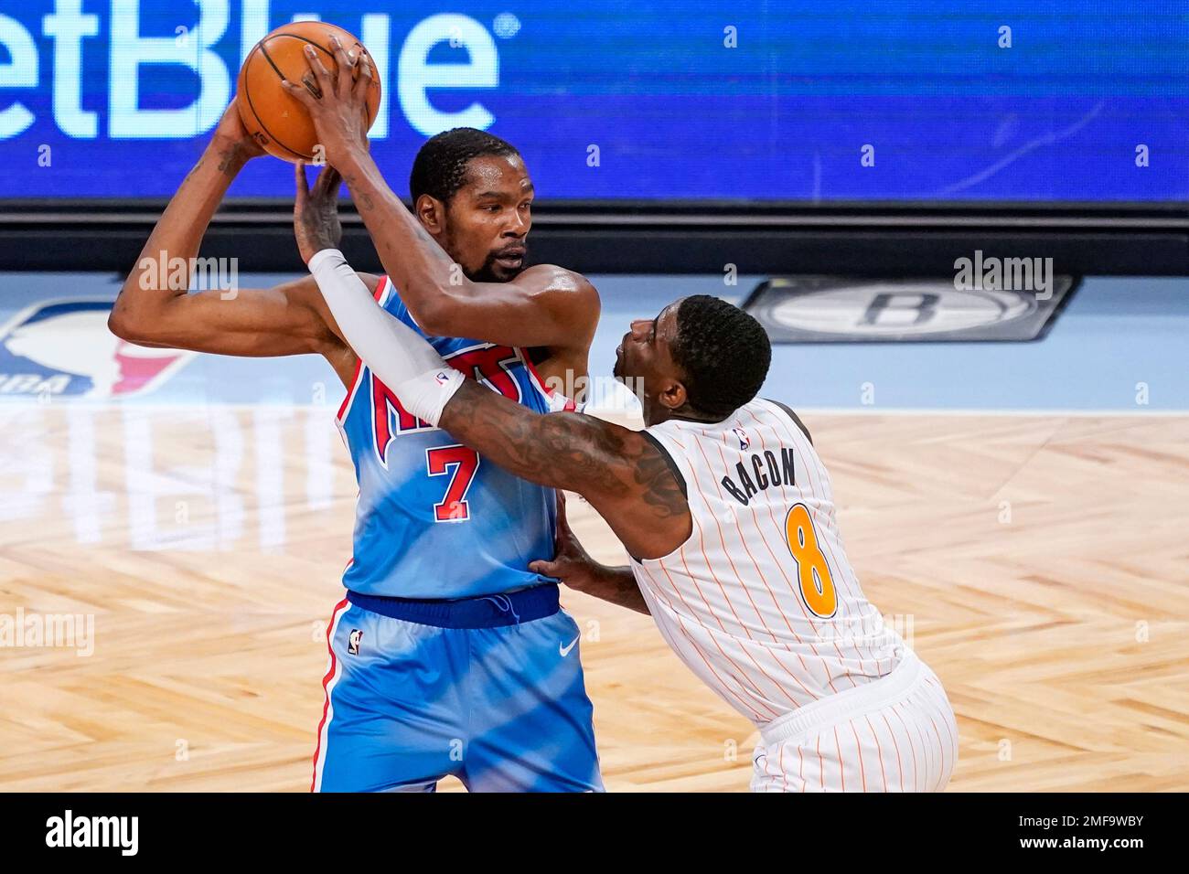 Orlando Magic forward Dwayne Bacon (8) guards Brooklyn Nets forward ...