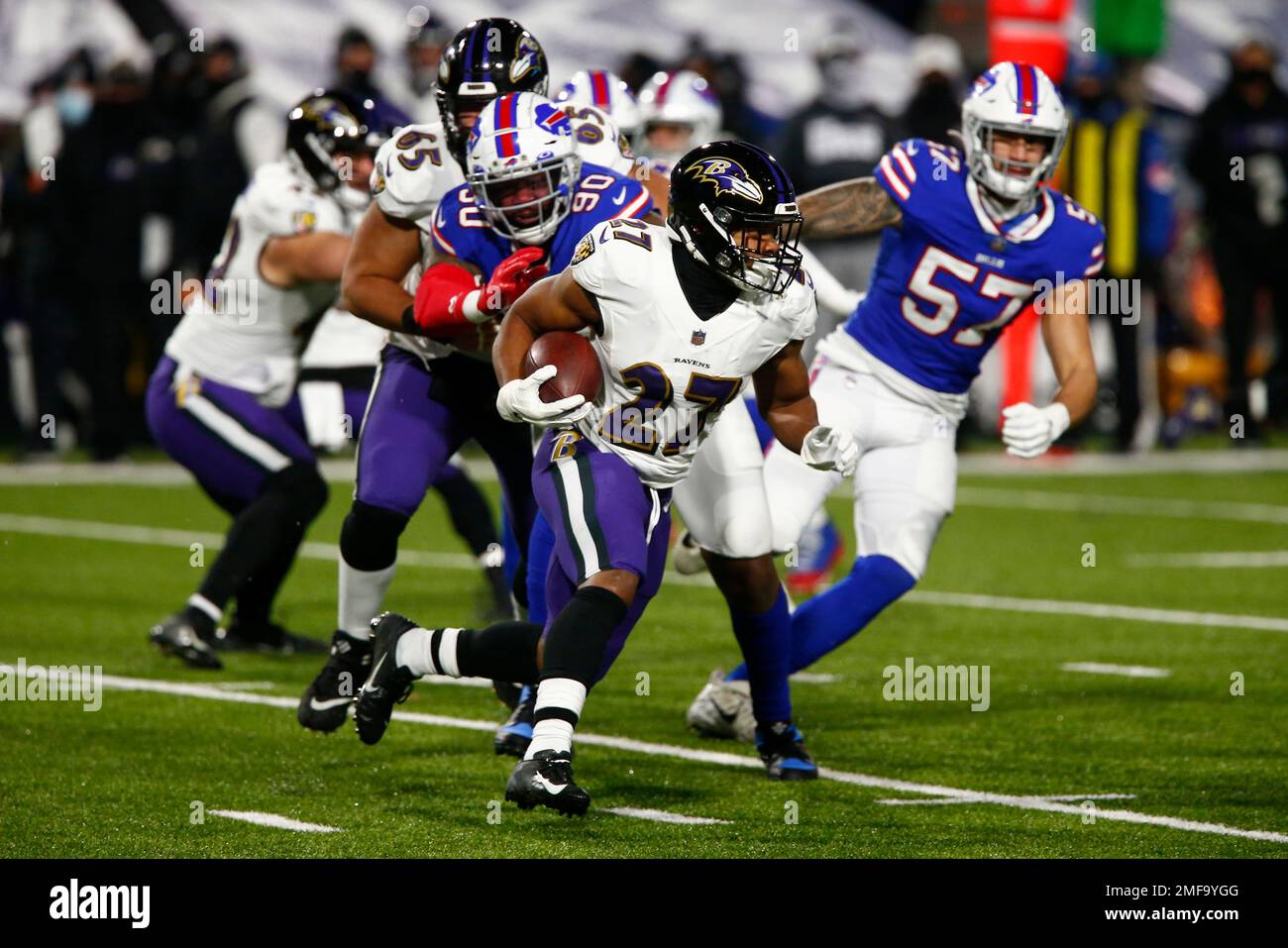 Baltimore Ravens' J.K. Dobbins (27) rushes during the first half of an ...