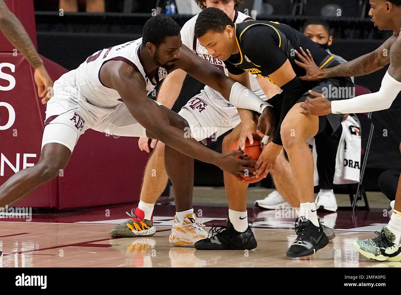 Texas A&M forward Kevin Marfo (45) steals the ball from Missouri guard ...