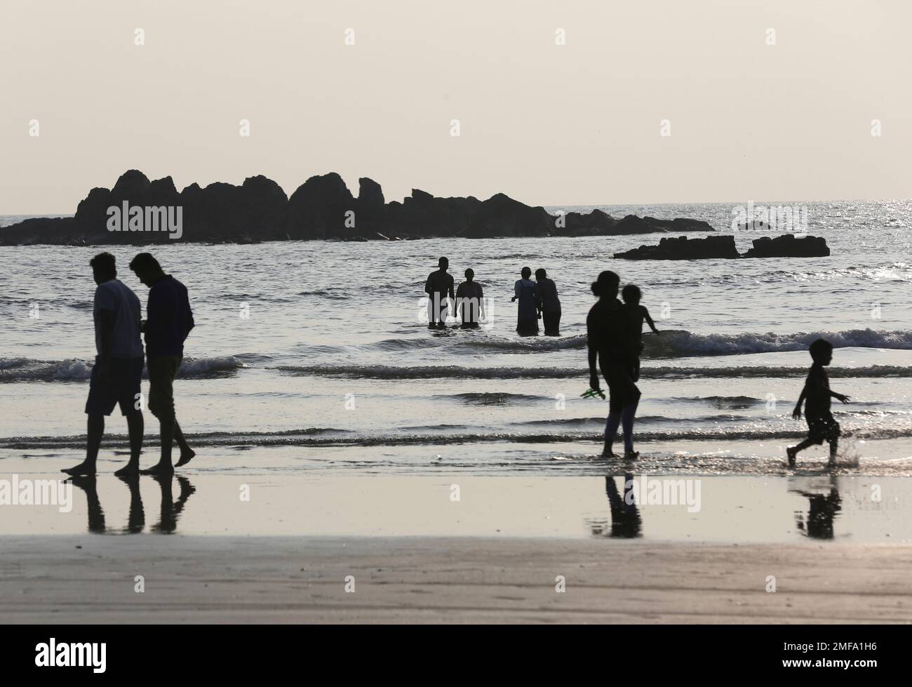 People spend time at the Muzhappilangad drive-in beach in Kannur ...