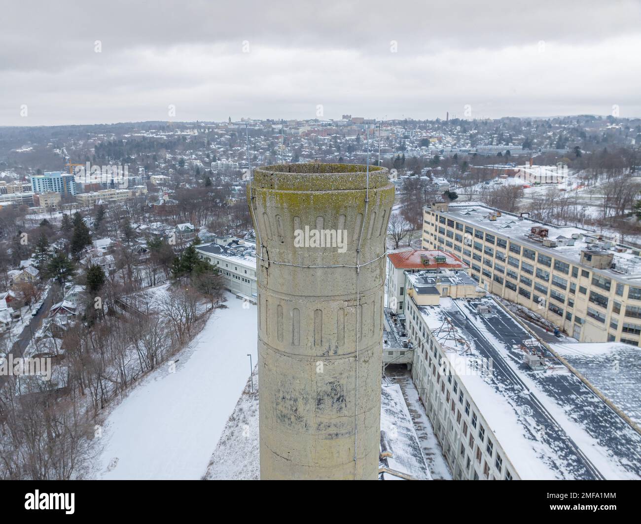 Winter aerial drone photo of an abandoned industrial concrete smoke ...
