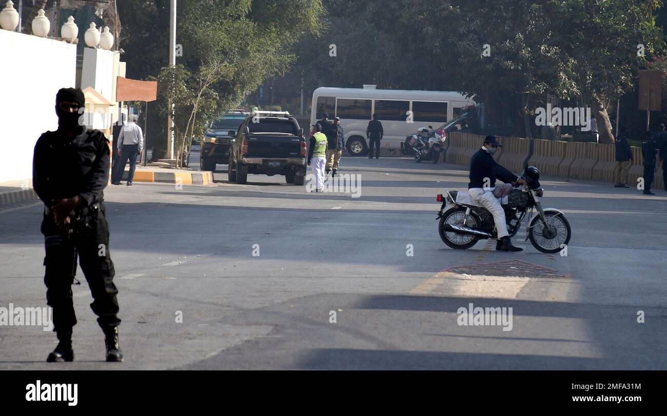 Pakistani police officers stand guard as a mini-bus transporting South ...