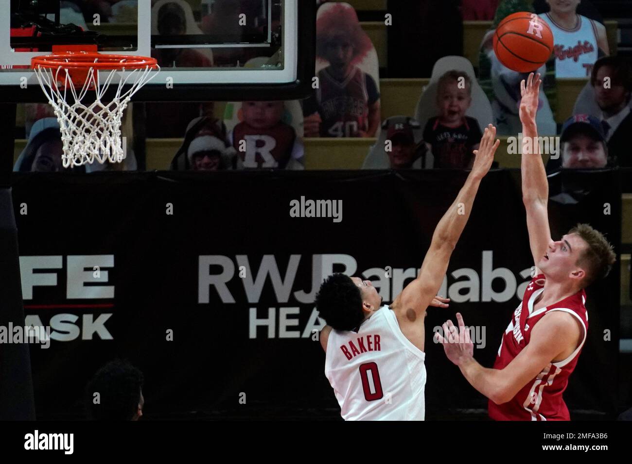 Wisconsin's Tyler Wahl, right, shoots over Rutgers' Geo Baker during ...