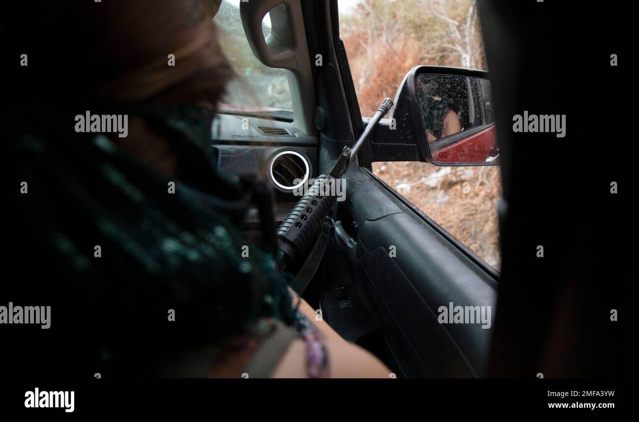 An armed woman known as "La Guera," who says she is a member of a ...
